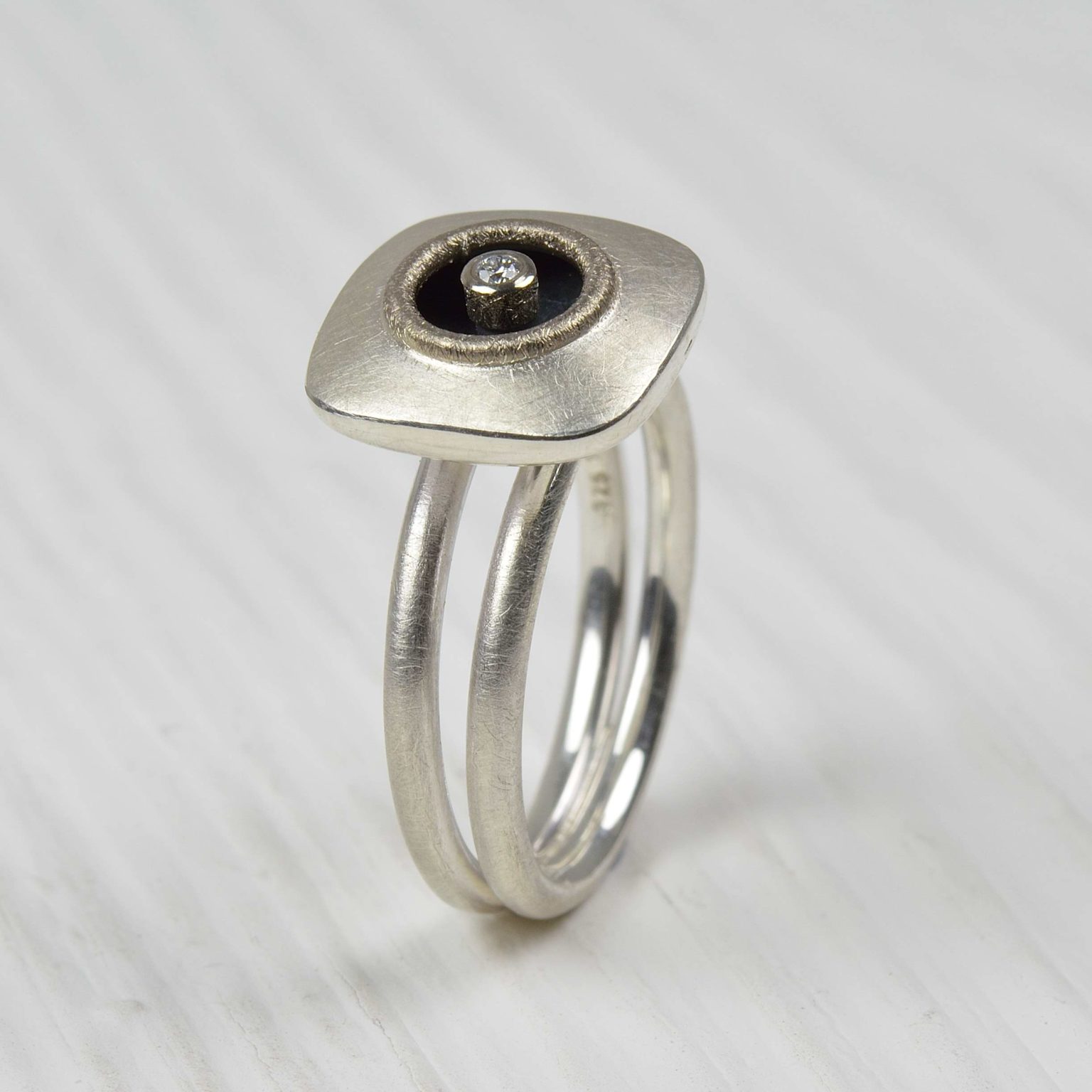 floating diamond ring - mh goldsmith